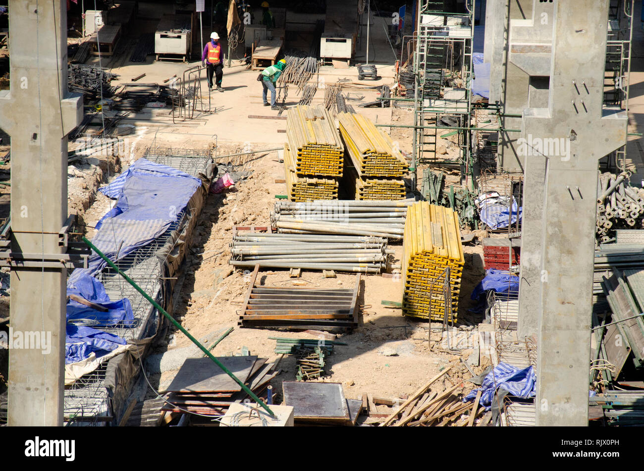 Asian people and thai workers with heavy machinery working builder new ...