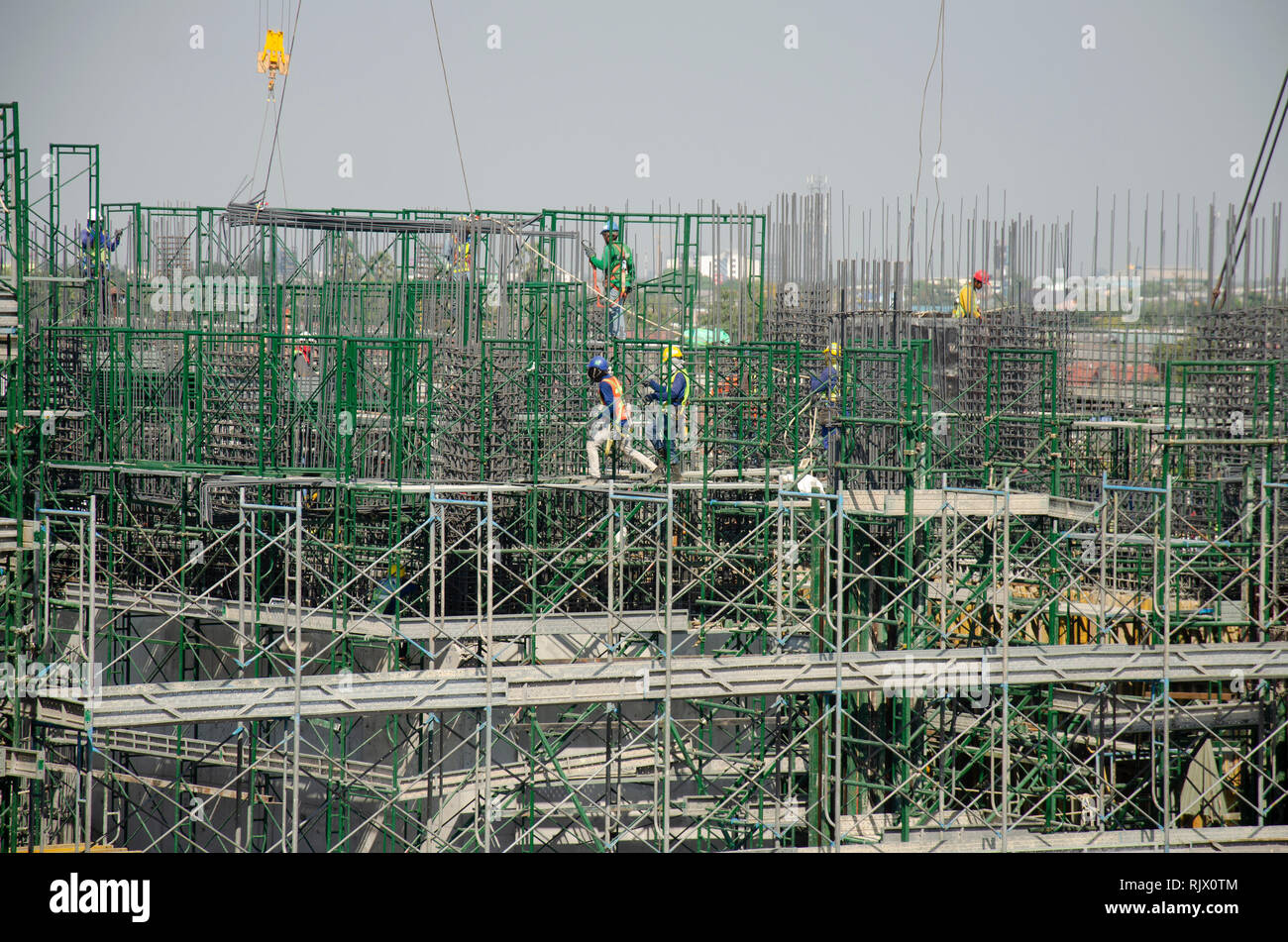 Asian people and thai workers with heavy machinery working builder new ...