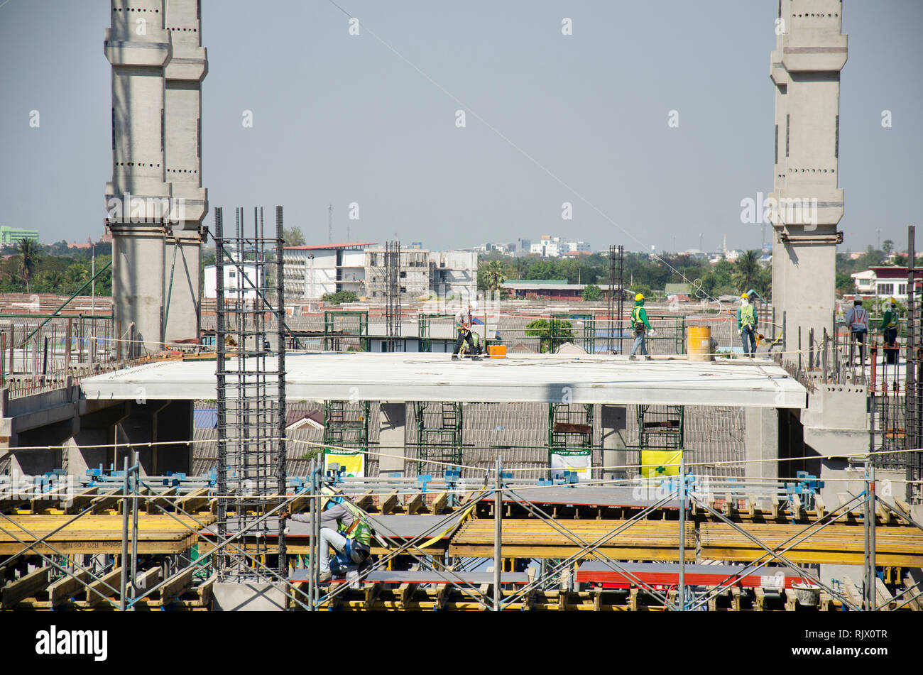 Asian people and thai workers with heavy machinery working builder new ...