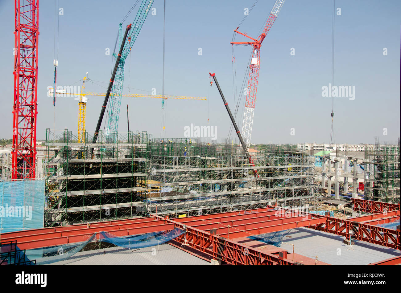 Asian people and thai workers with heavy machinery working builder new ...