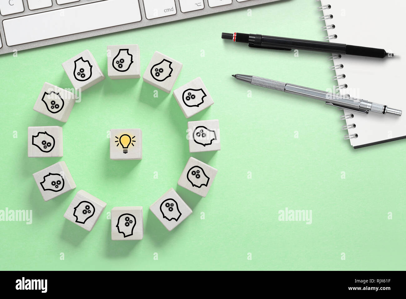 many people together having an idea symbolized by icons on cubes Stock ...