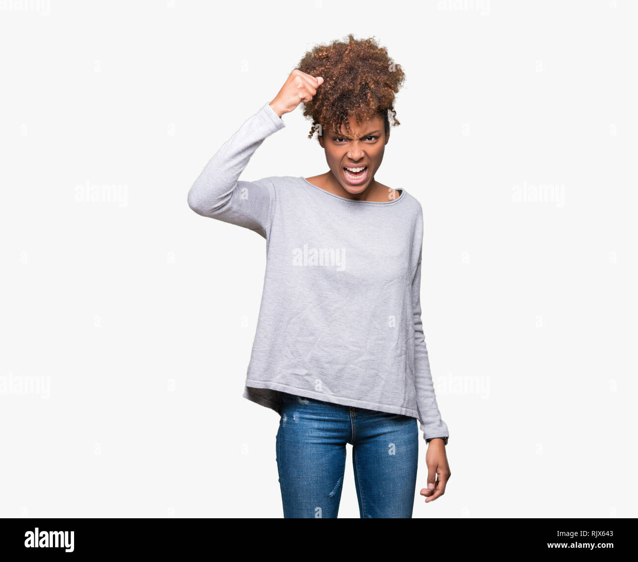 Beautiful young african american woman over isolated background angry ...