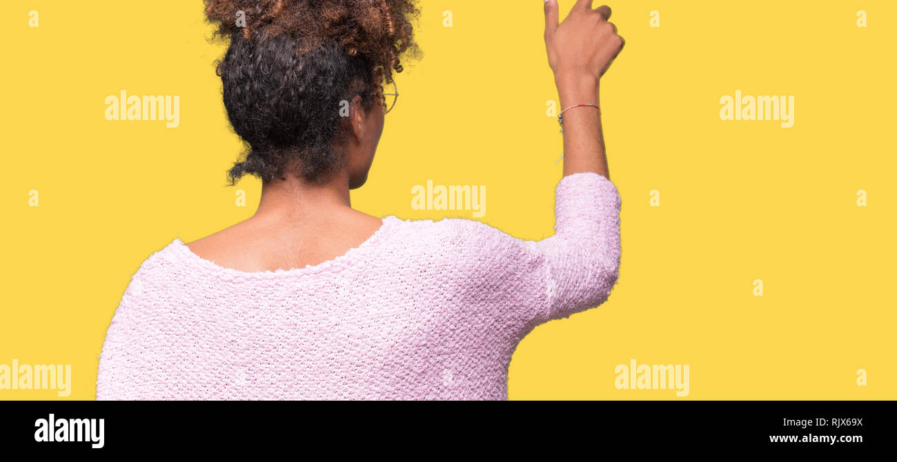 Beautiful young african american woman wearing glasses over isolated ...