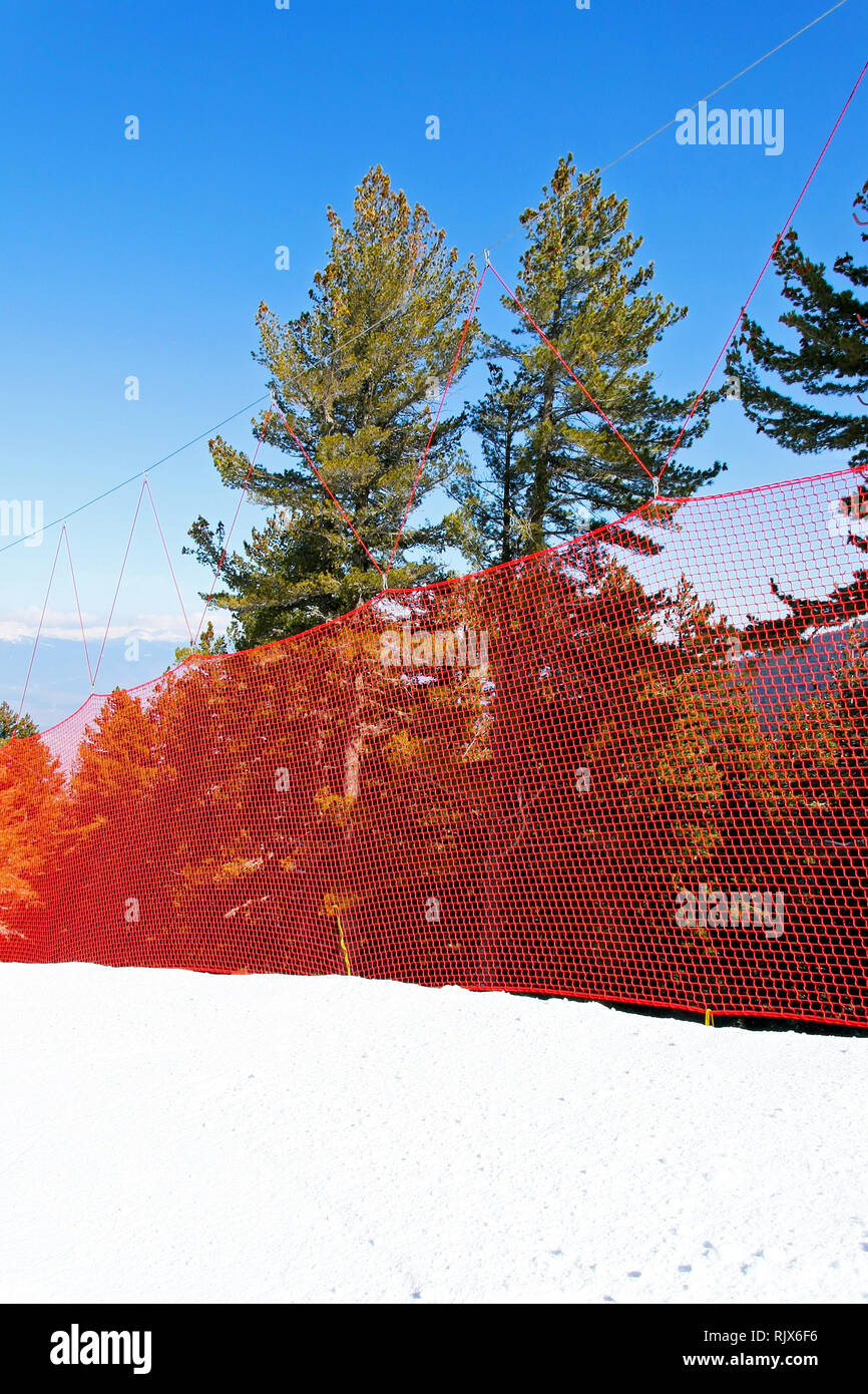 Safety net on the side of ski slope Stock Photo - Alamy