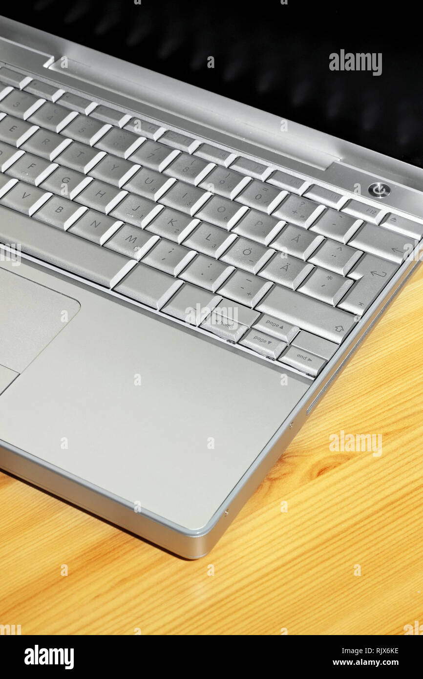 Open silver metal notebook over wooden desk Stock Photo - Alamy