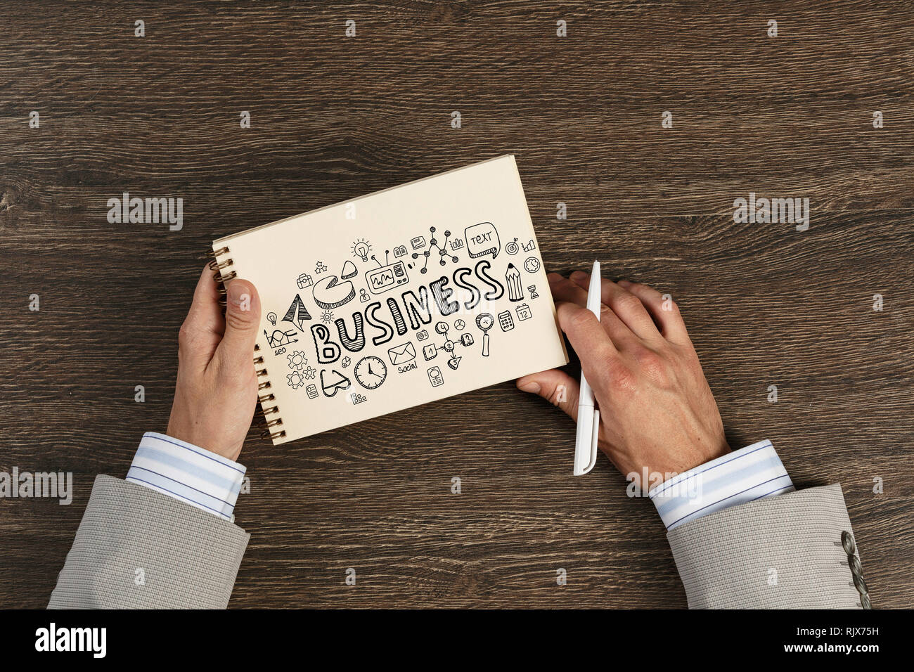 Top view of businessman at workplace and notepad with sketches Stock ...