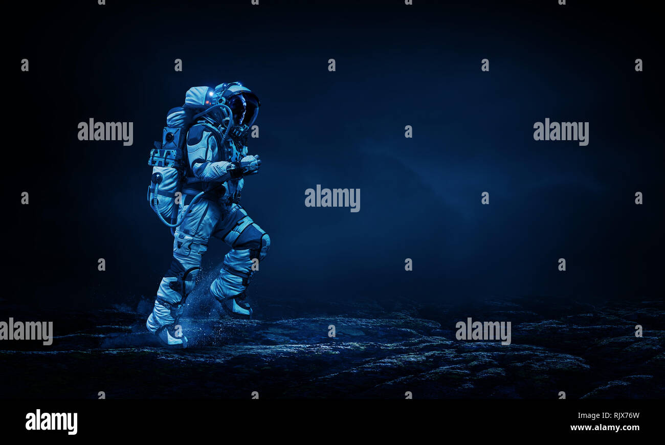Astronaut in spacesuit running on planet surface. Mixed media Stock ...