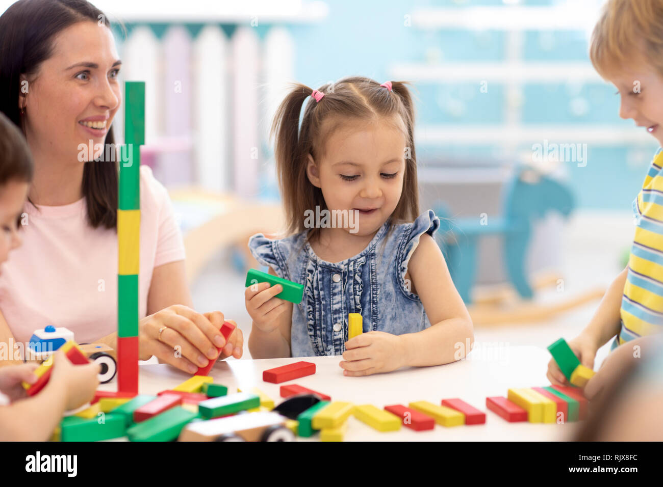 Little children building block toys at home or day care centre. Kids ...