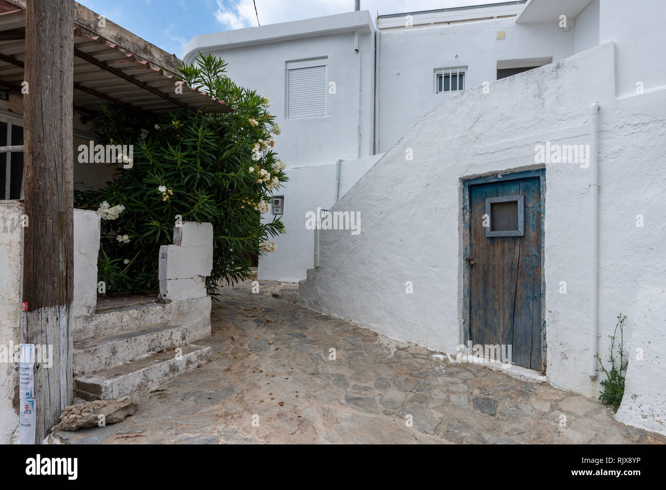 small alley with old houses in a small Crete village Stock Photo - Alamy