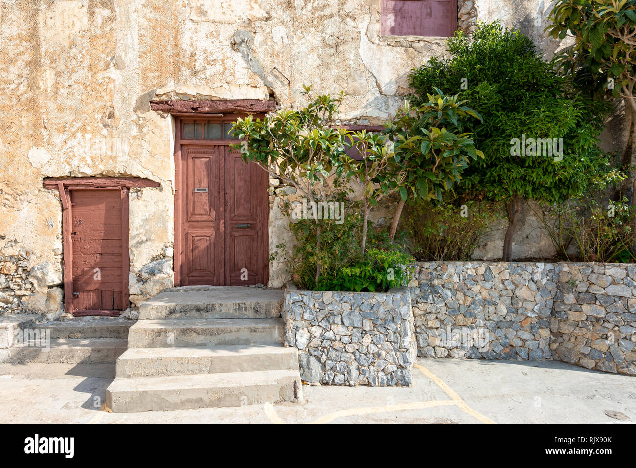old buildings in the courtyard of monastery Preveli in Crete, Greece ...