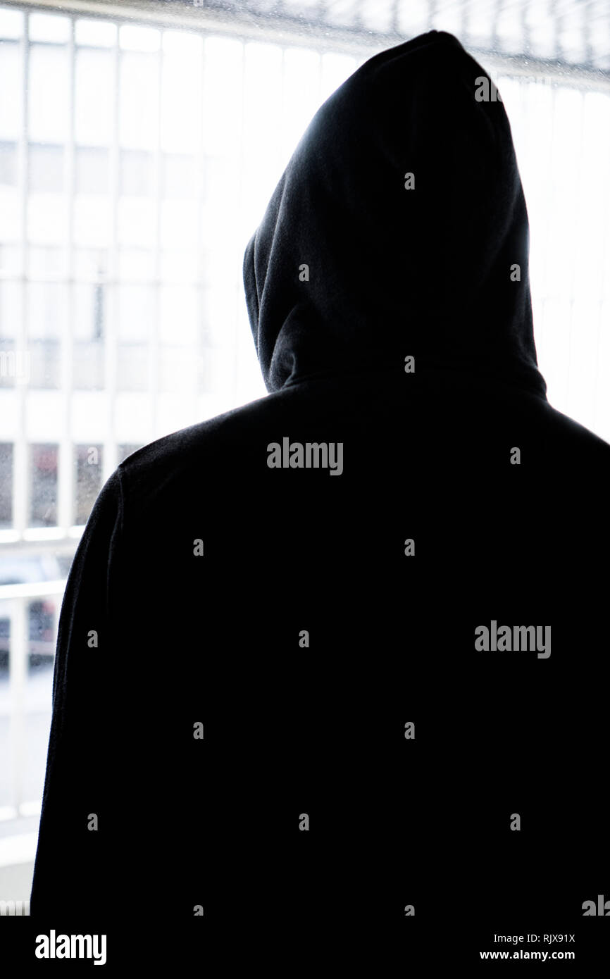 Rear view of a hooded male Stock Photo - Alamy