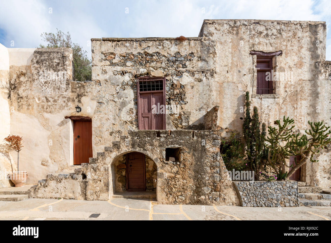 old buildings in the courtyard of monastery Preveli in Crete, Greece ...
