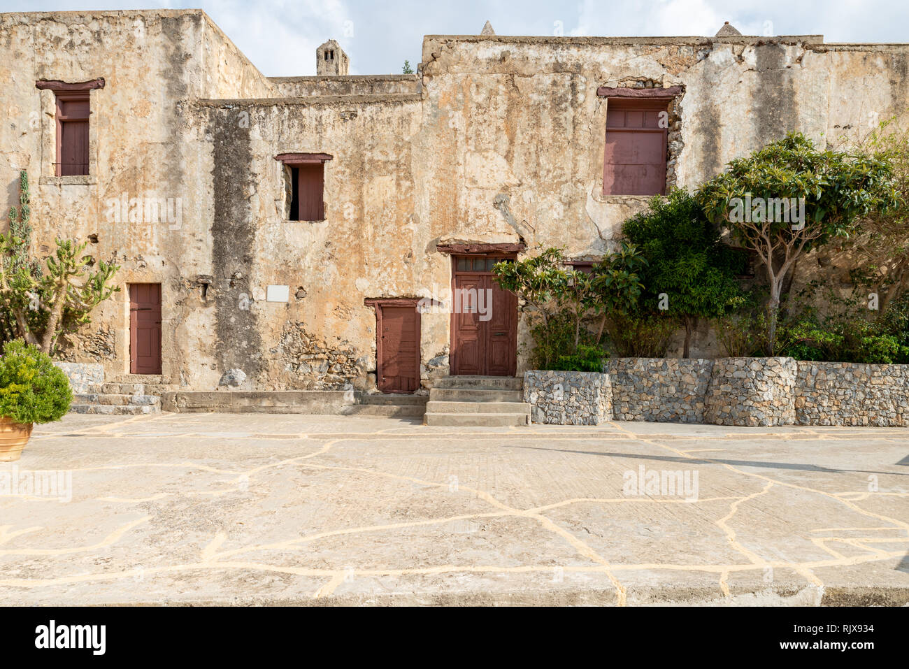 old buildings in the courtyard of monastery Preveli in Crete, Greece ...