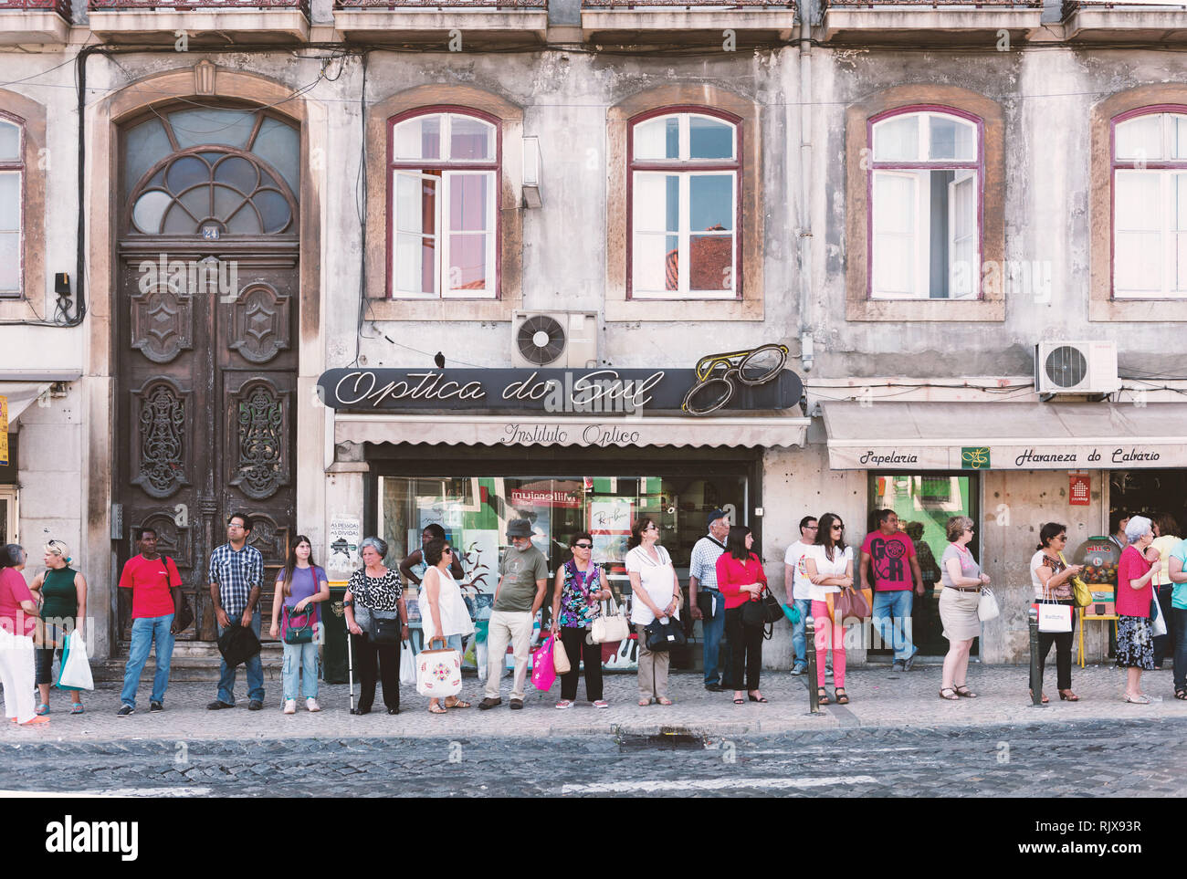 Crowd people waiting bus stop hi-res stock photography and images - Alamy