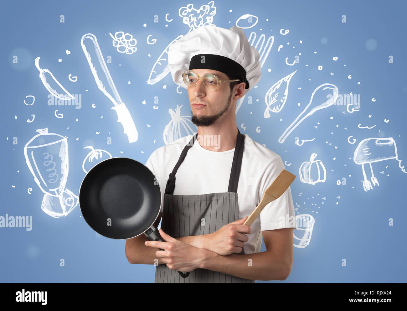 Young cook with kitchen instruments and drawn recipe concept on ...