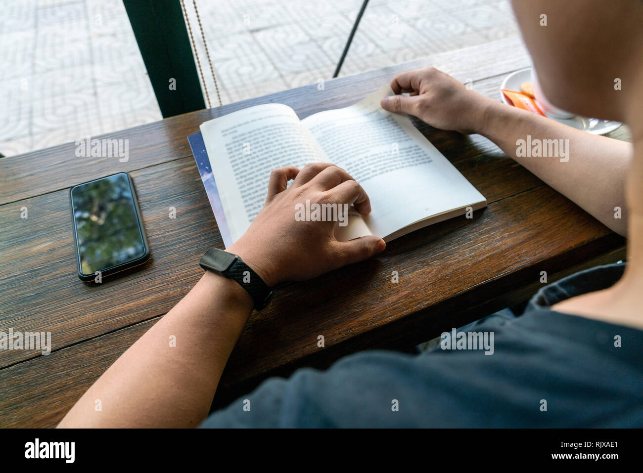 Rear view person sitting reading paper hi-res stock photography and ...
