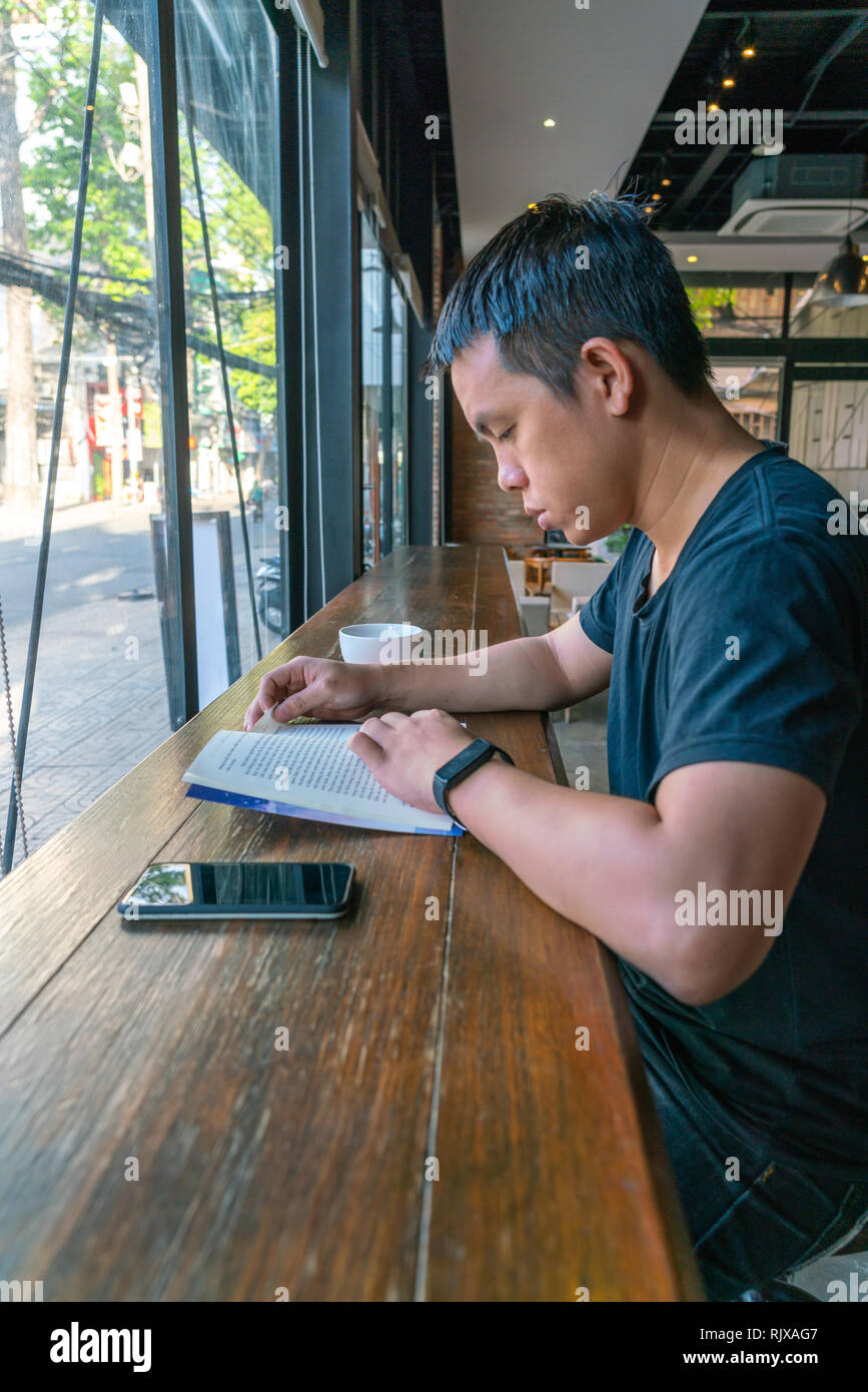 Asian man read on hi-res stock photography and images - Alamy