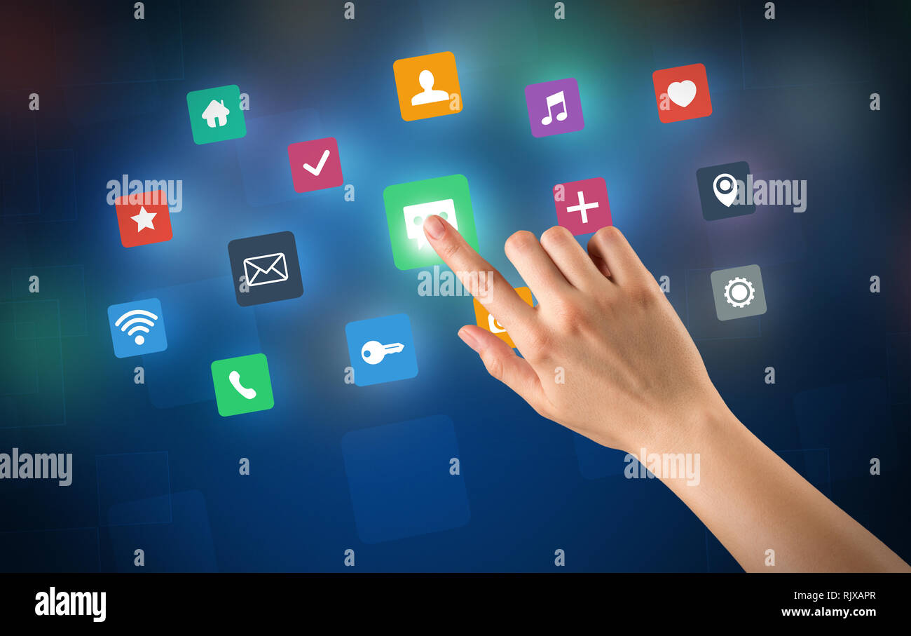 Female hand touching colorful applications Stock Photo - Alamy