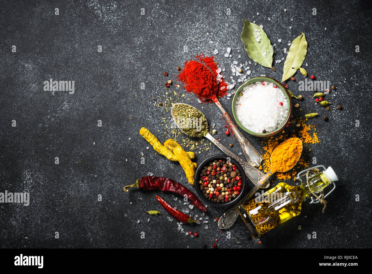 Set of various spices on black stone background Stock Photo - Alamy