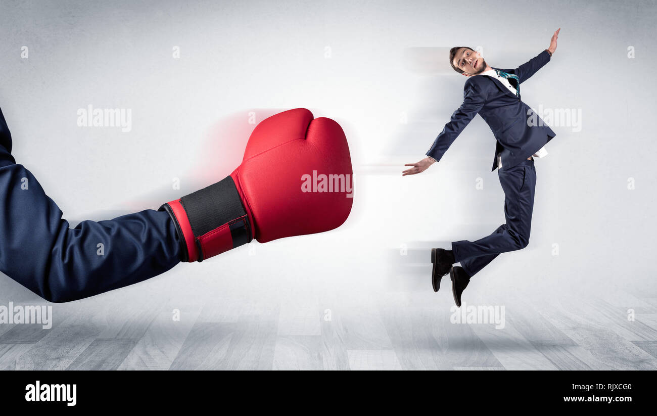 Big red boxing glove knocks out little businessman concept Stock Photo ...