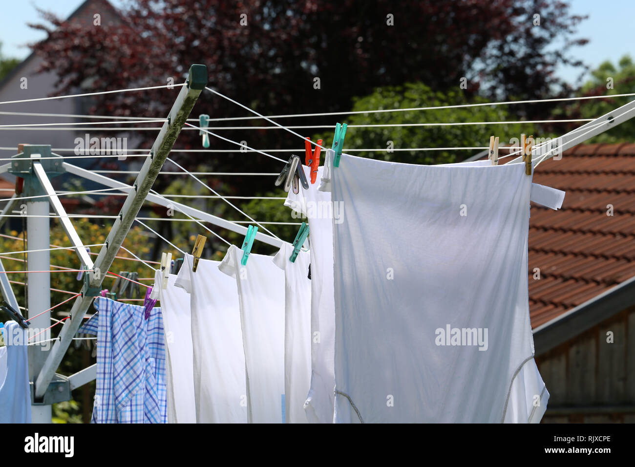 Washing clothes washed on a rope Stock Photo - Alamy