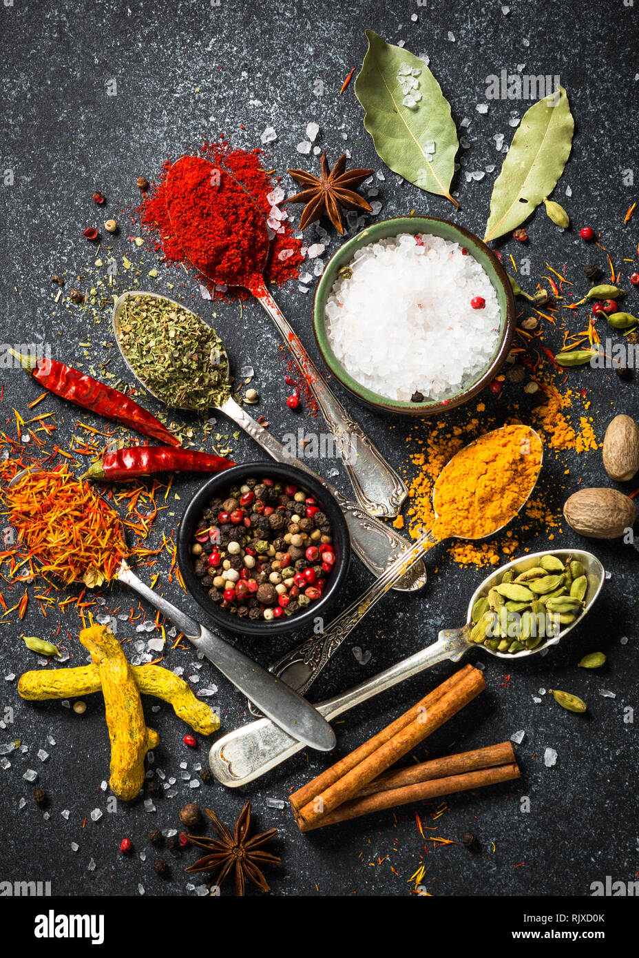 Set of various spices on black stone background Stock Photo - Alamy
