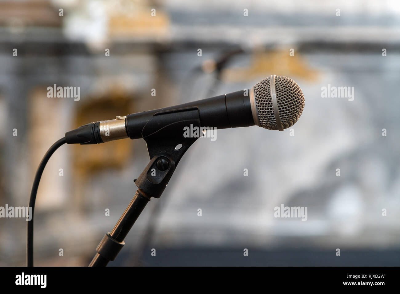 Close up of microphone in concert hall or conference room isolated ...