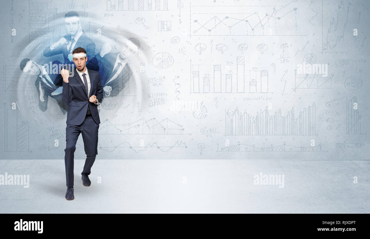 Young businessman in suit fighting with chart and report concept Stock ...