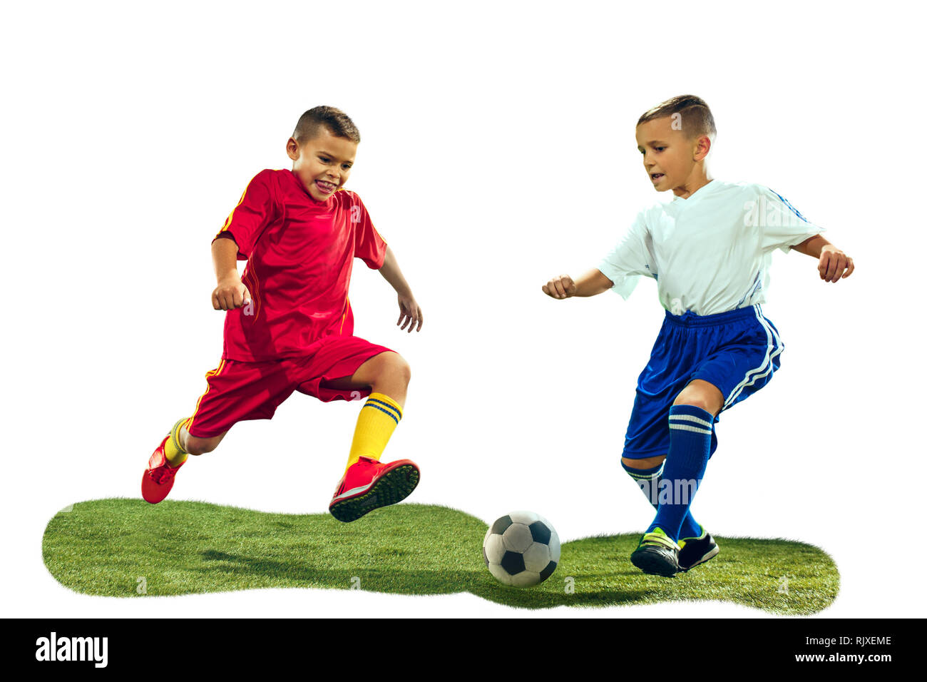 Young boys kicks the soccer ball. Isolated photo on white background ...