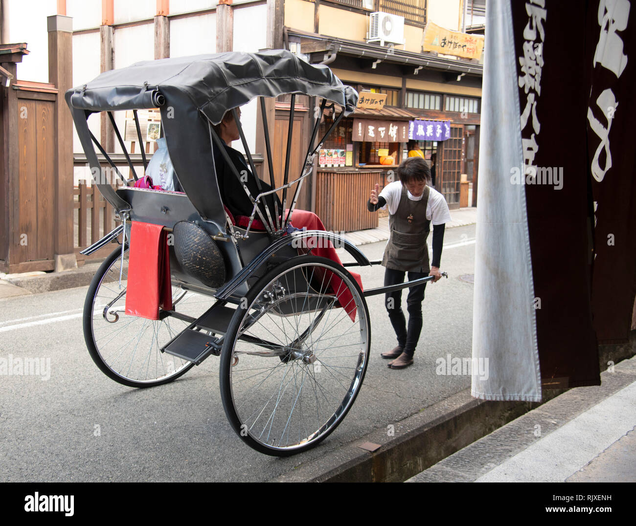 Tourists in a rickshaw in Takayama, Japan Stock Photo - Alamy