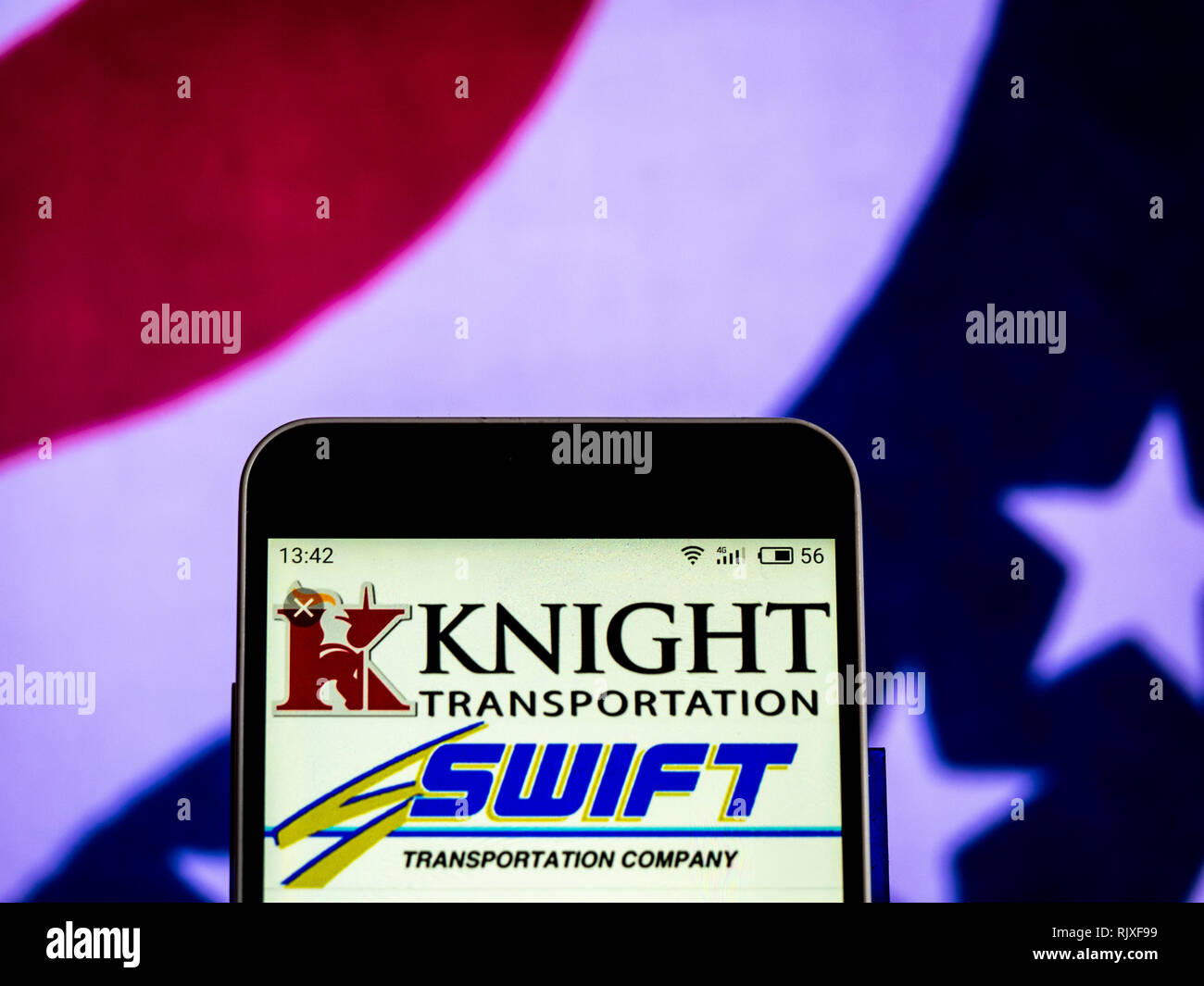 Knight-Swift Transportation Holdings Inc. logo seen displayed on smart ...