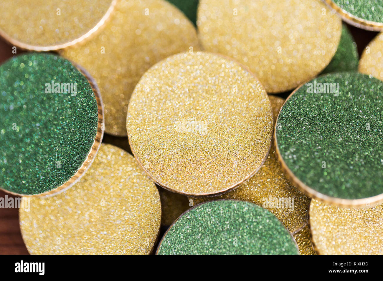 close up of golden and green coins Stock Photo - Alamy