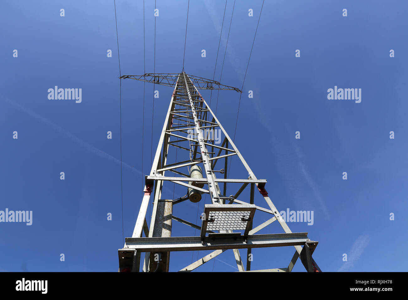 Transmission line on background of blue sky Stock Photo - Alamy