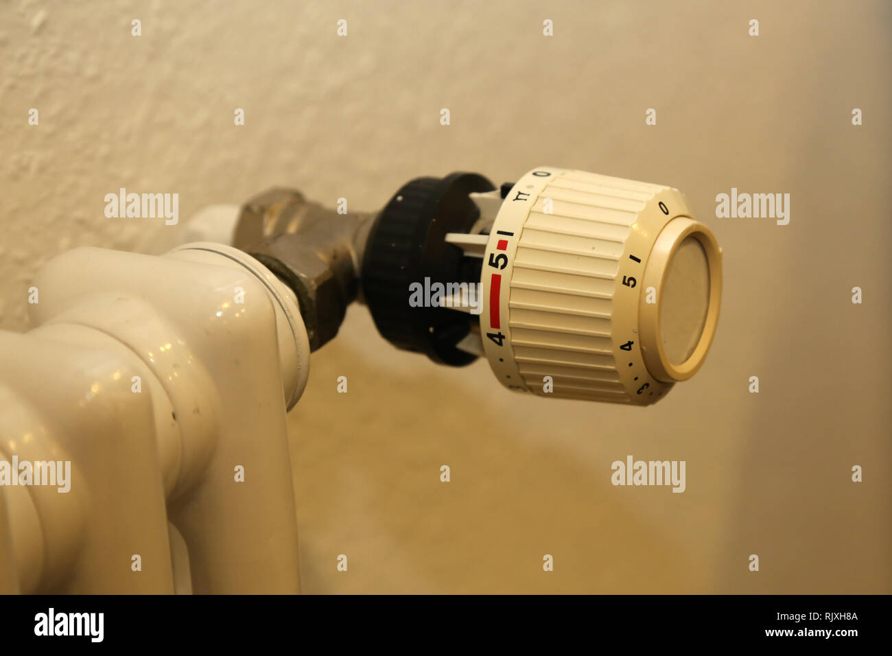 Panel heating with heat regulator. White radiator Stock Photo - Alamy