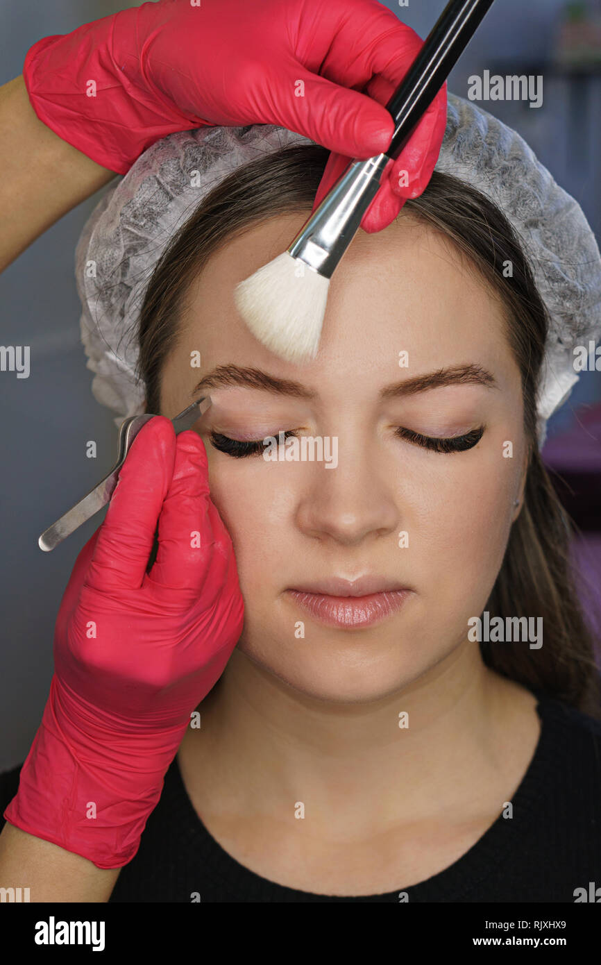 Eyebrow correction. Final stage of creating perfect shape of eyebrows ...