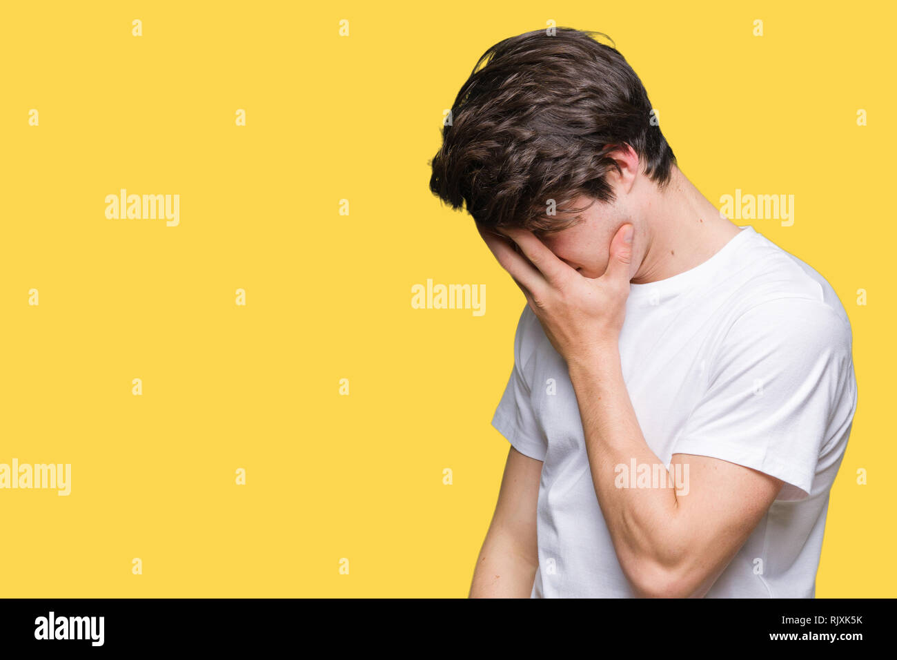 Young handsome man wearing casual white t-shirt over isolated ...