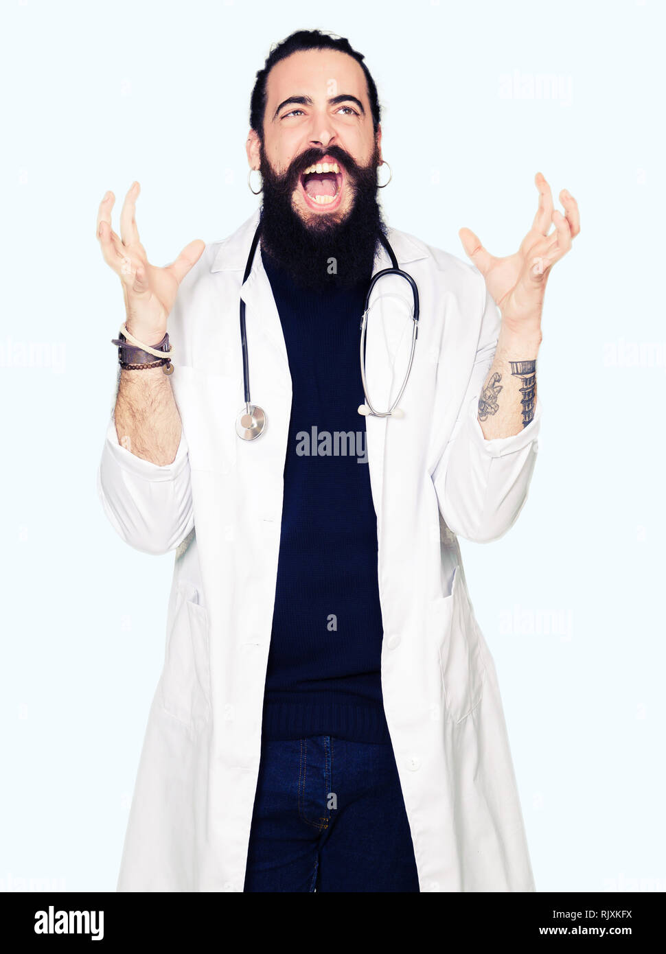 Doctor with long hair wearing medical coat and stethoscope crazy and ...