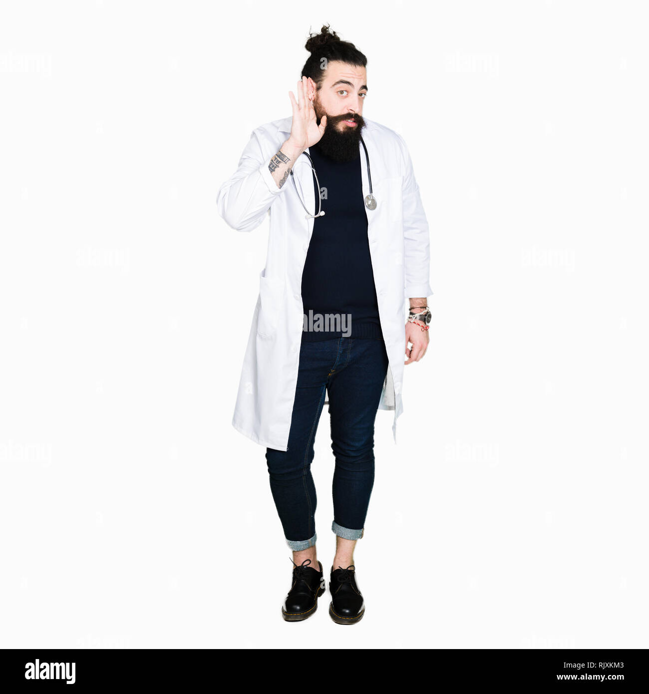 Doctor with long hair wearing medical coat and stethoscope smiling with ...