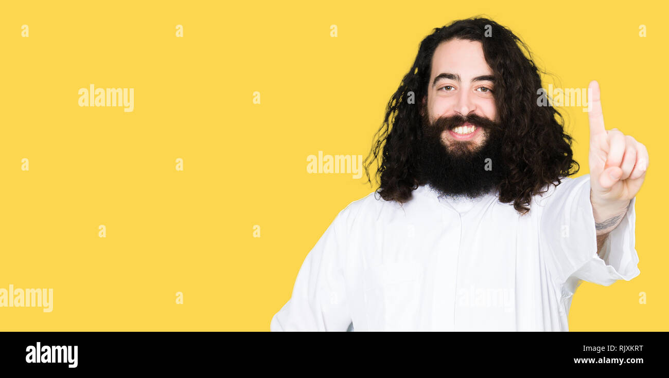Man wearing Jesus Christ costume showing and pointing up with finger ...