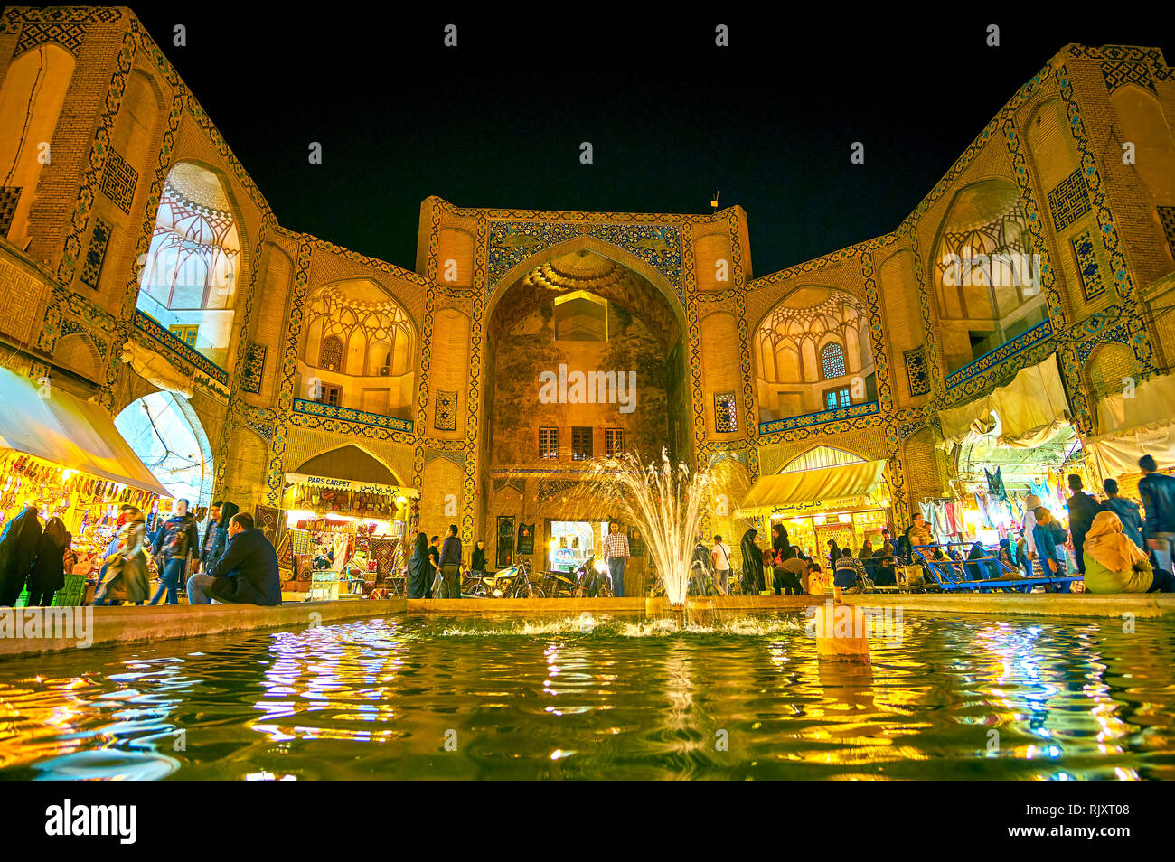 ISFAHAN, IRAN - OCTOBER 19, 2017: the small pool with a fountain at the ...