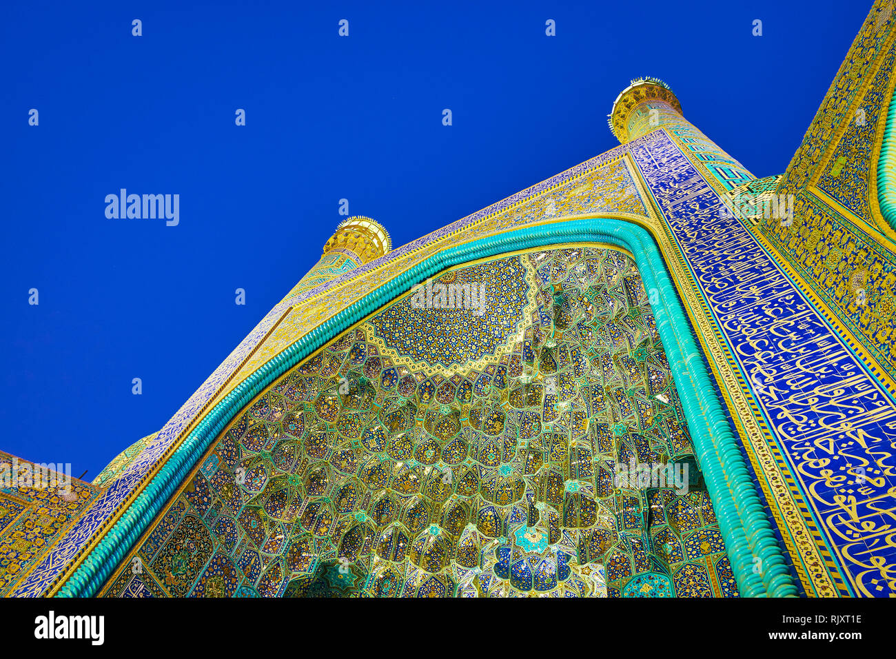 The colorful tiled muqarnas on central portal of shah Mosque with ...