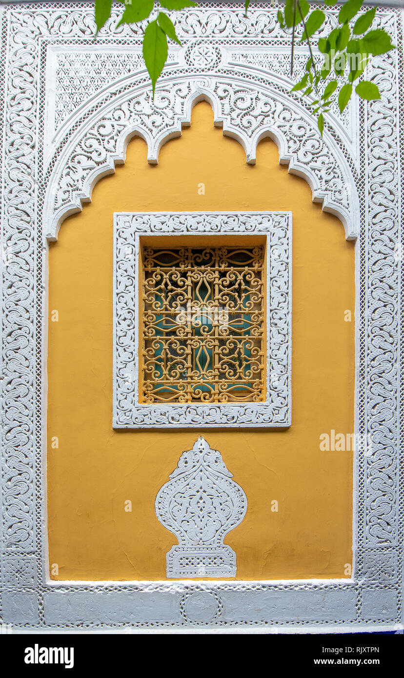 Typical, old, ornate intricately carved, studded, Moroccan riad window ...