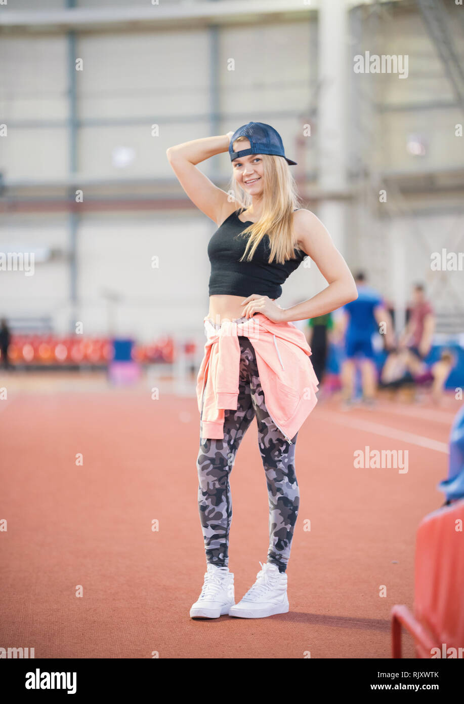 Young healthy woman in a good shape posing for the camera Stock Photo ...