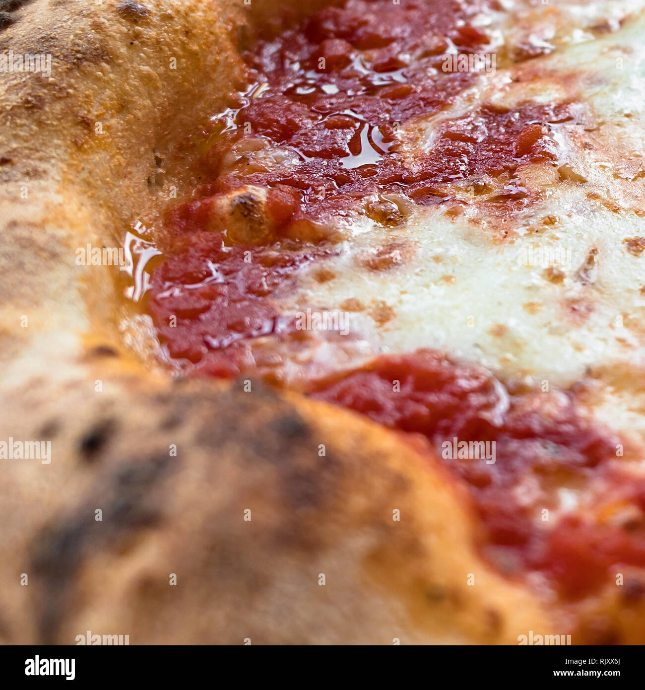 Italy. Real Pizza Margherita cooked in a wood oven. Close-up. Shallow ...