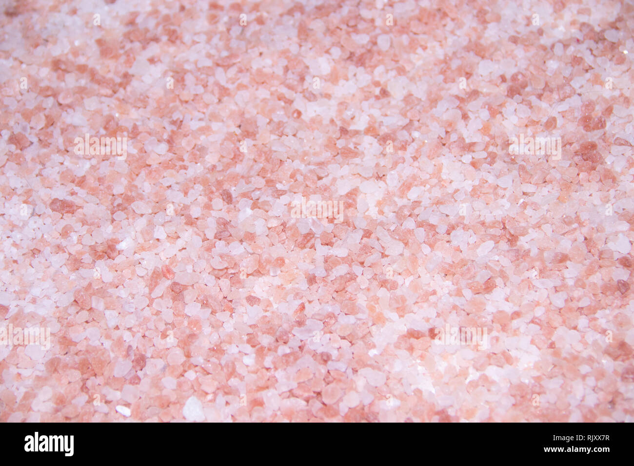 Texture sea pink salt. Useful spa treatments. Pink salt granules ...