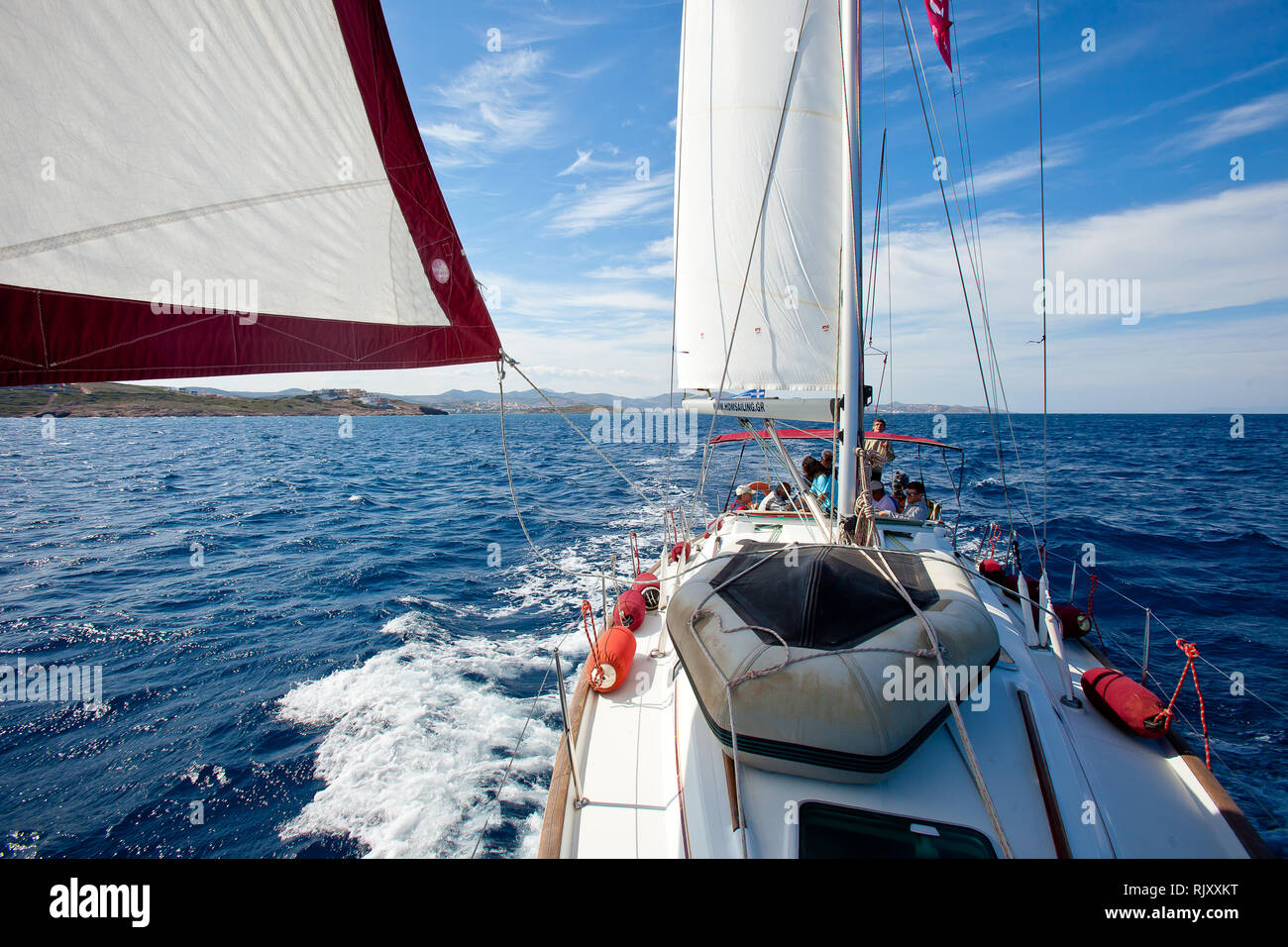 Open sail of our boat heading to Kythnos island Stock Photo - Alamy