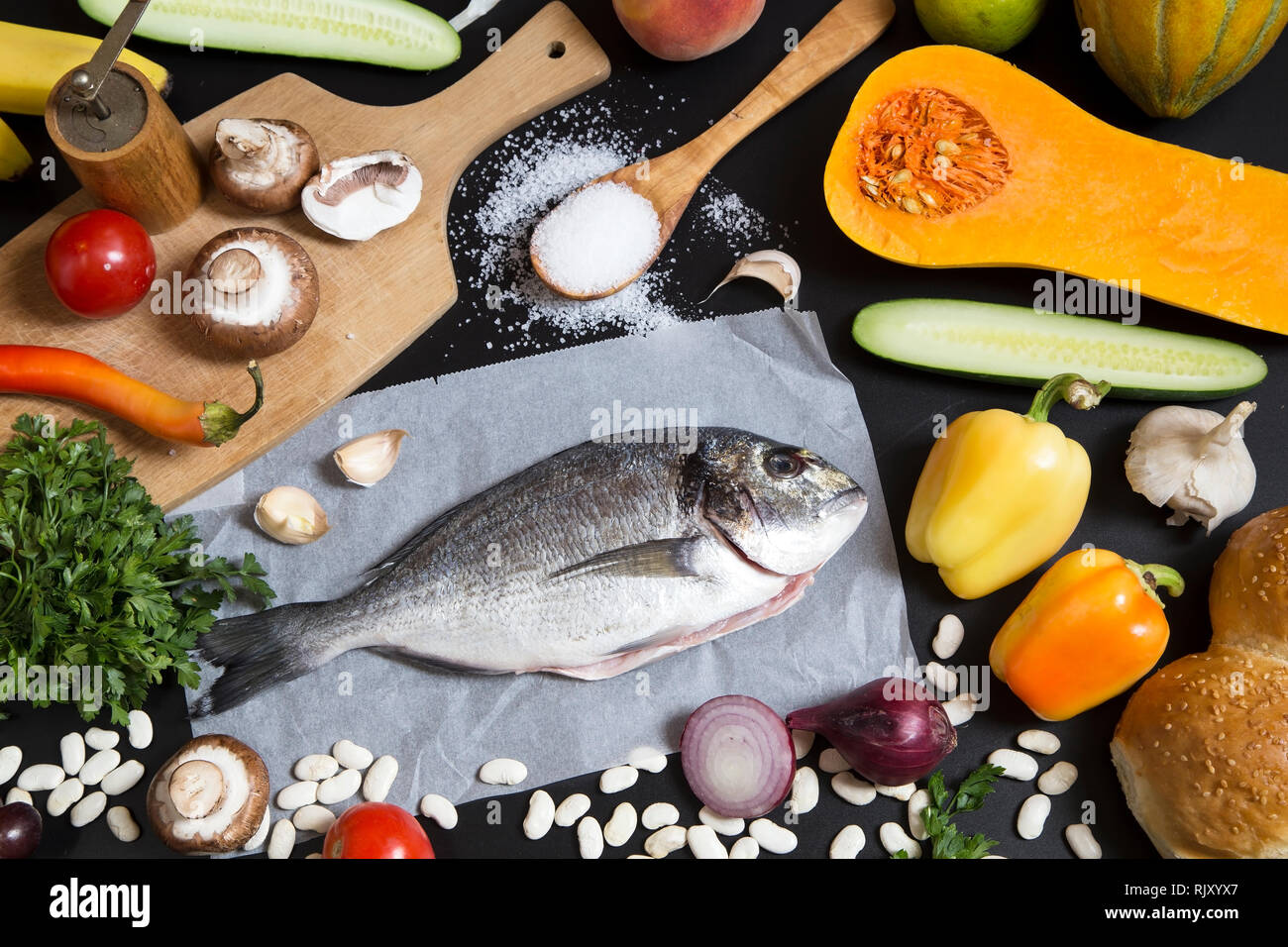 Food ingredients and aurata fish Stock Photo - Alamy