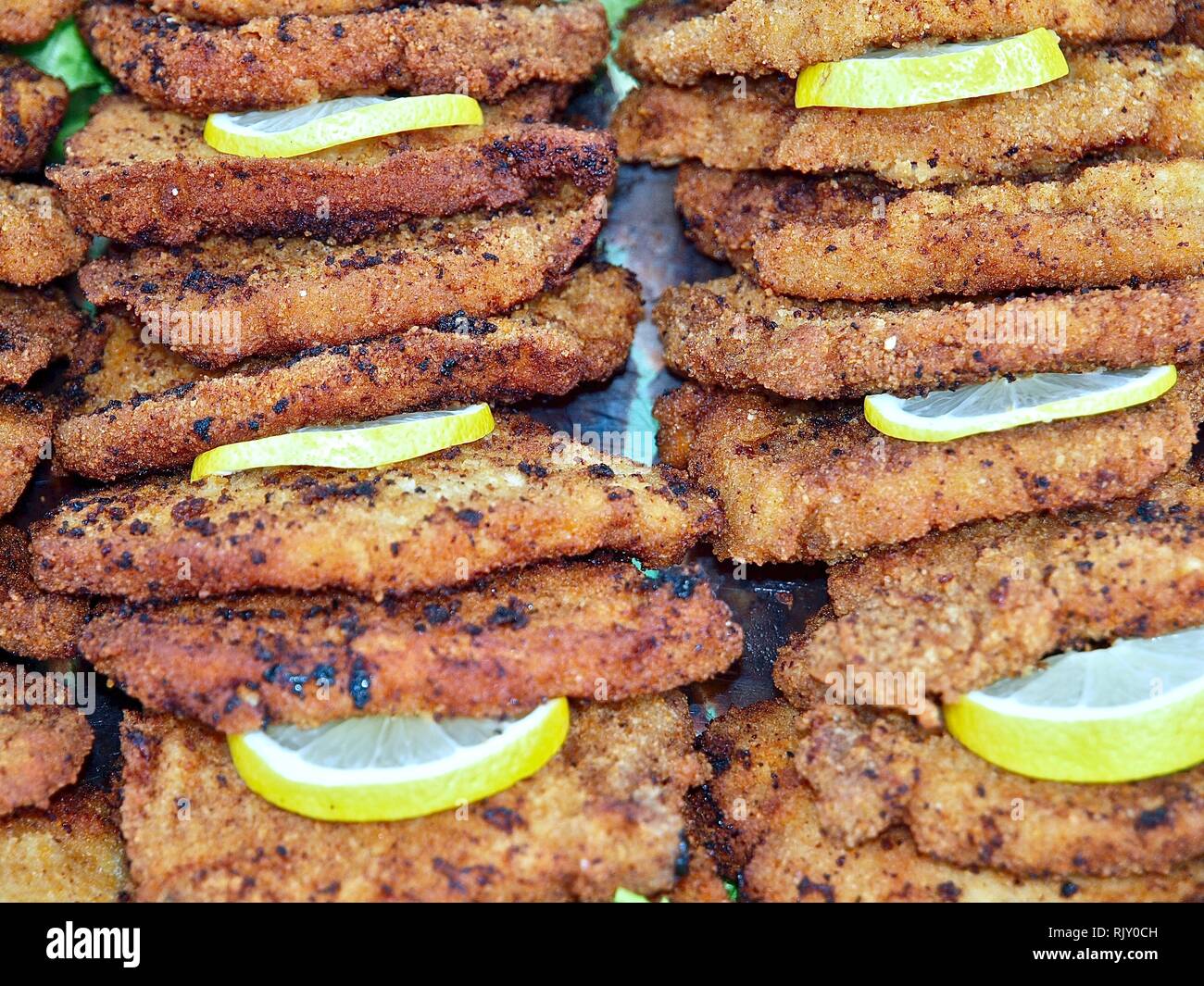 Breaded cutlets with lemon, called Wiener Schnitzel Stock Photo - Alamy