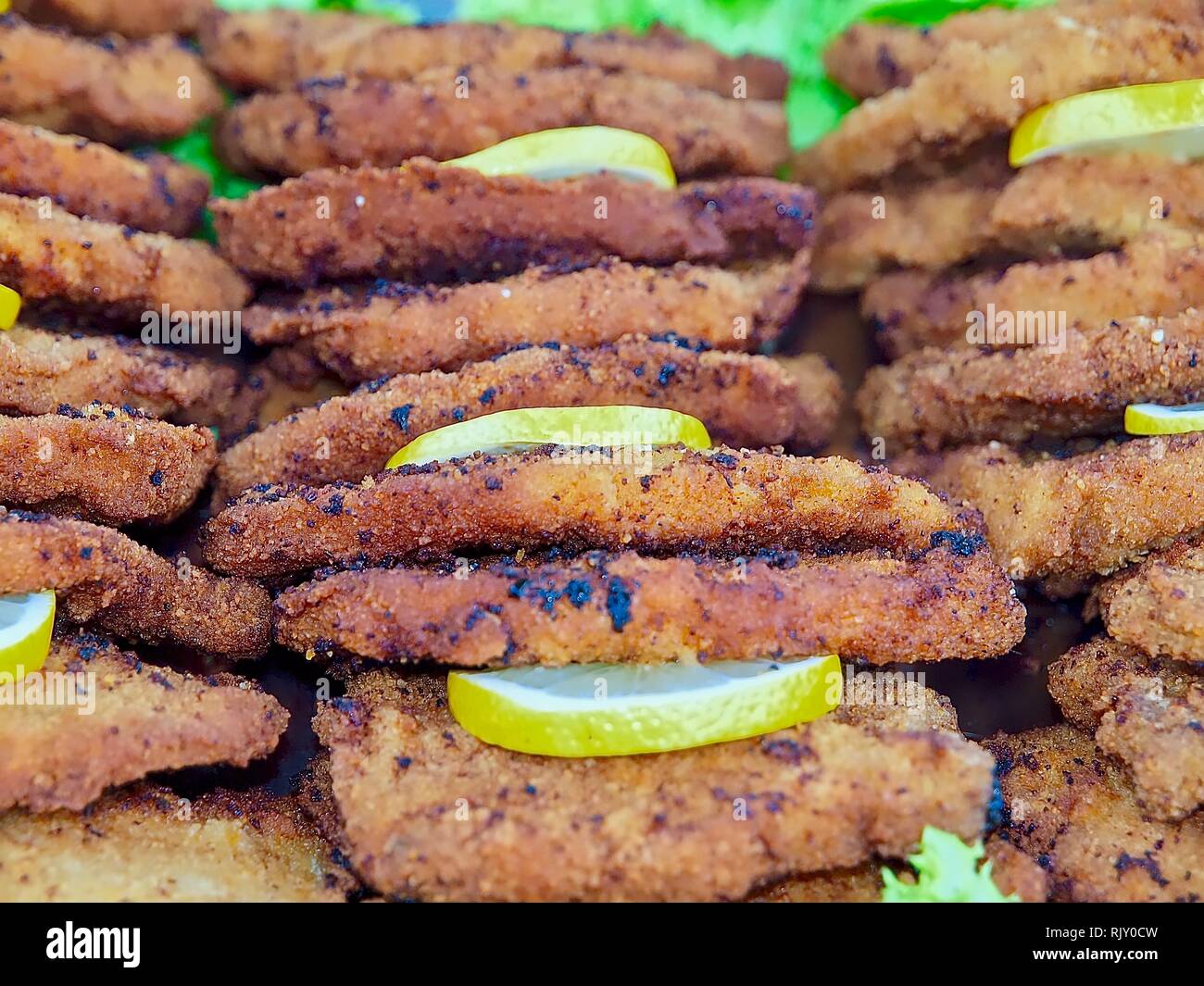 Breaded cutlets with lemon, called Wiener Schnitzel Stock Photo - Alamy