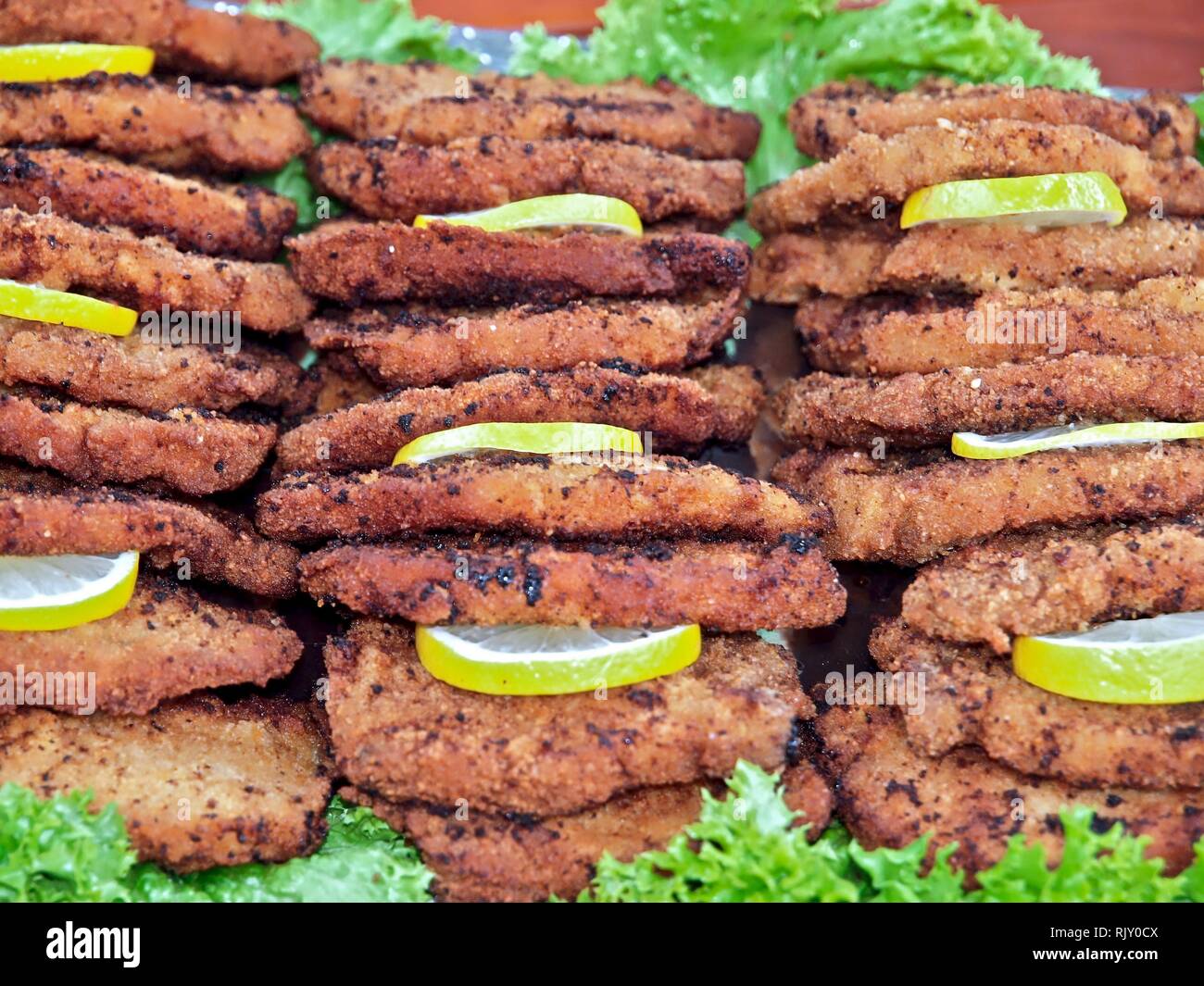 Breaded cutlets with lemon, called Wiener Schnitzel Stock Photo - Alamy